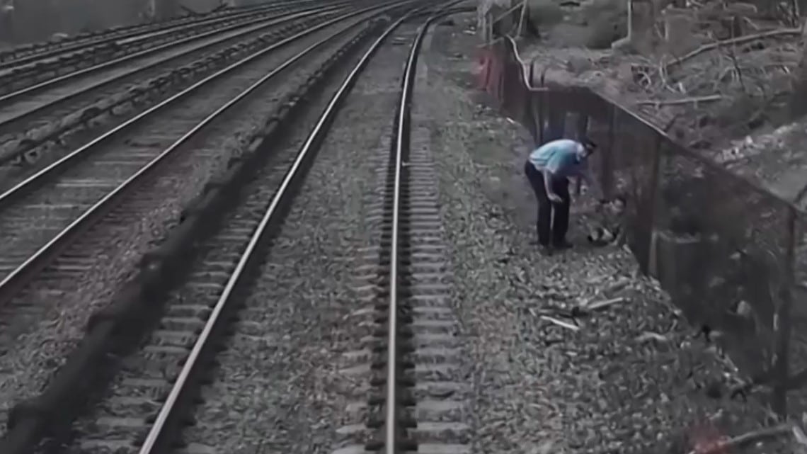 Caught on camera: Railroad conductor sprints to rescue 3-year-old from ...